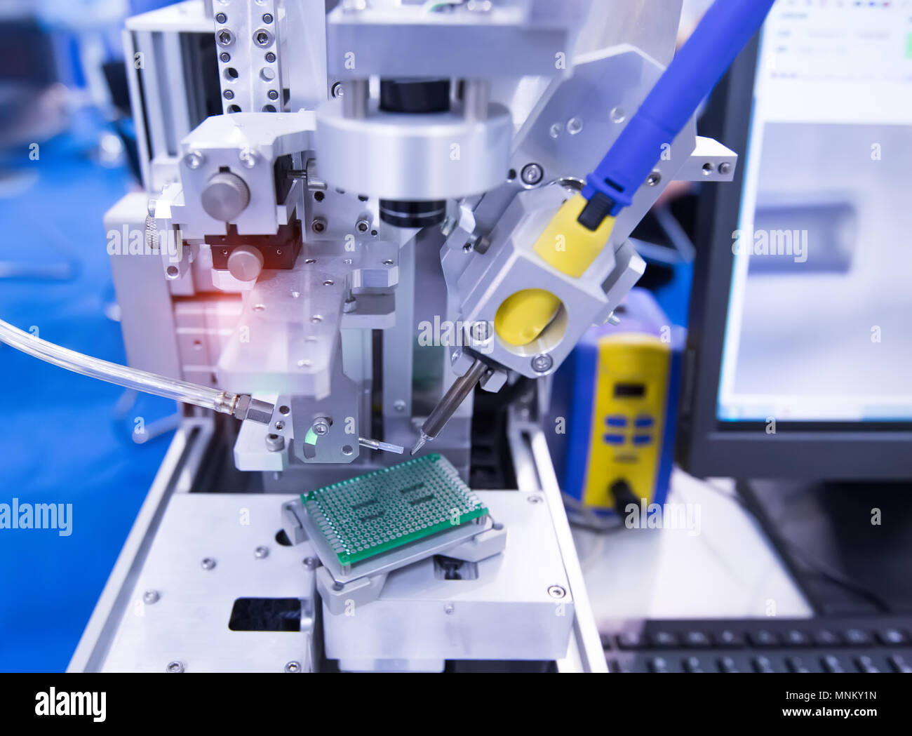 robot machine tool at printed circuit boards industrial manufacture ...