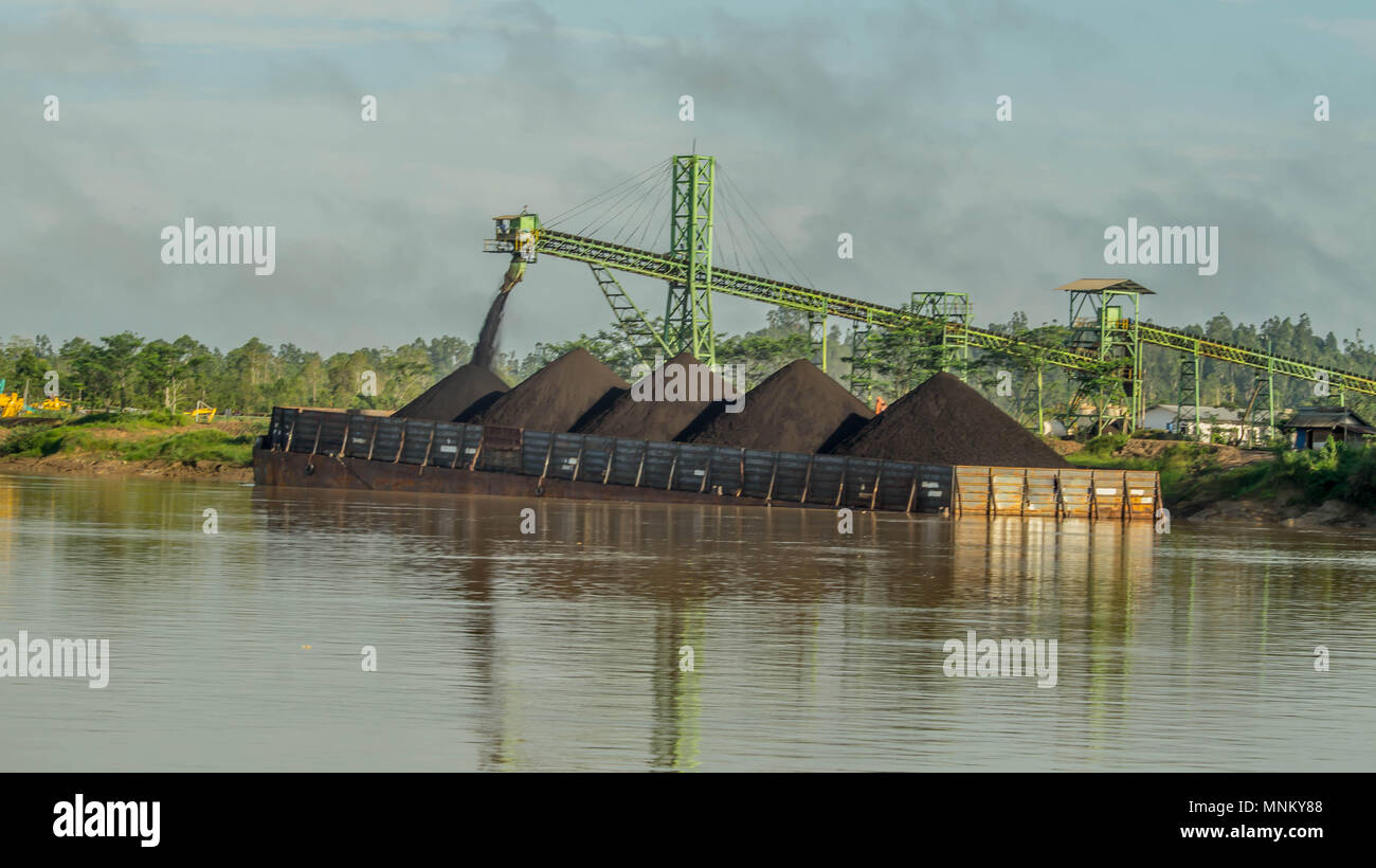 barge is loaded with coal using conveyor in the stockpile on the ...