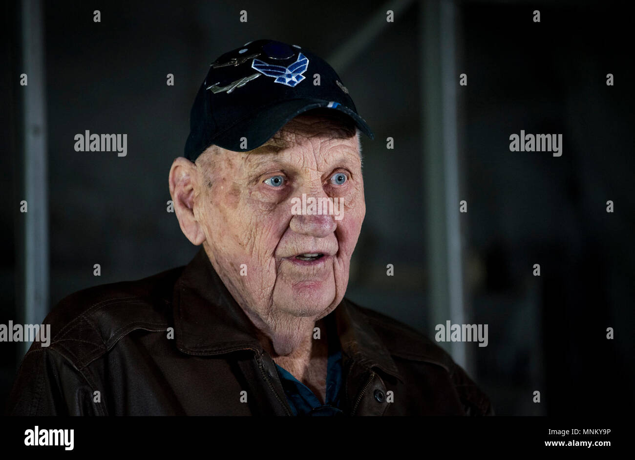 Retired Chief Master Sgt. Jack Pledger provides remarks inside of a C ...