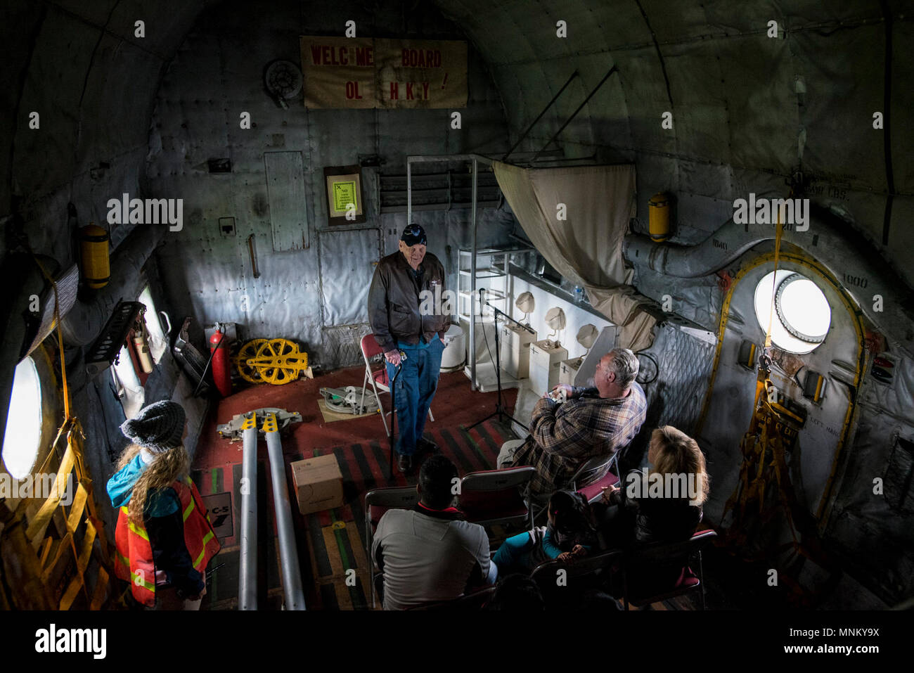 Retired Chief Master Sgt. Jack Pledger provides remarks inside of a C ...