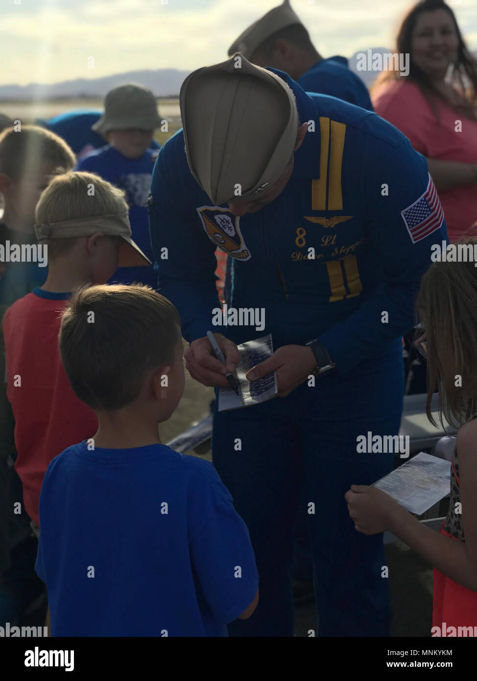 A U.S. Navy Blue Angel pilot signs souvenirs for Make-A-Wish Arizona ...