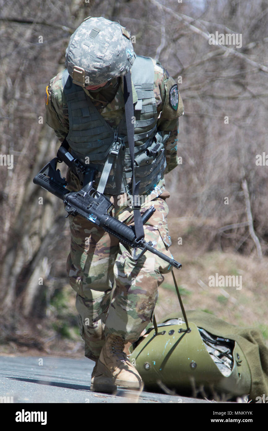 Pfc. Joseph Breining, 115th Military Police Battalion, pulls a Skedco ...