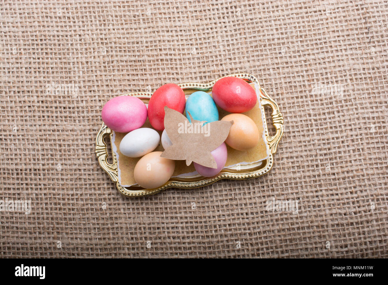 Paper Butterfly on Colorful candy sweets in tray Stock Photo - Alamy