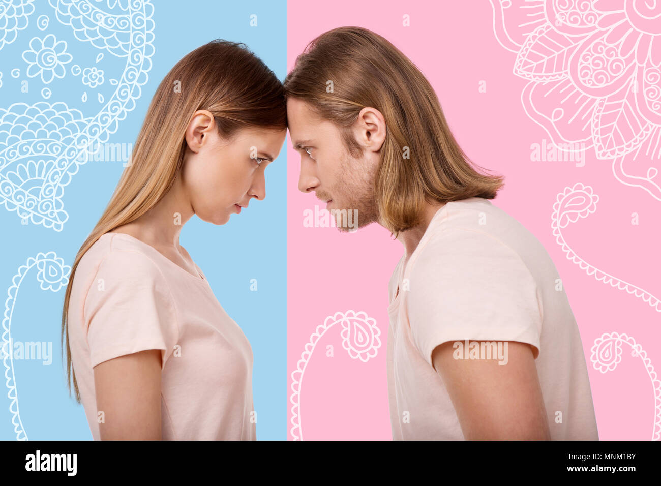 Angry young people touching their foreheads and looking stubborn Stock ...