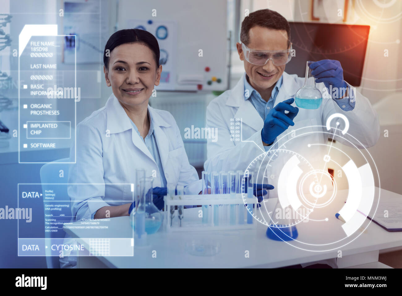 Friendly scientist sitting in their laboratory and working with test ...