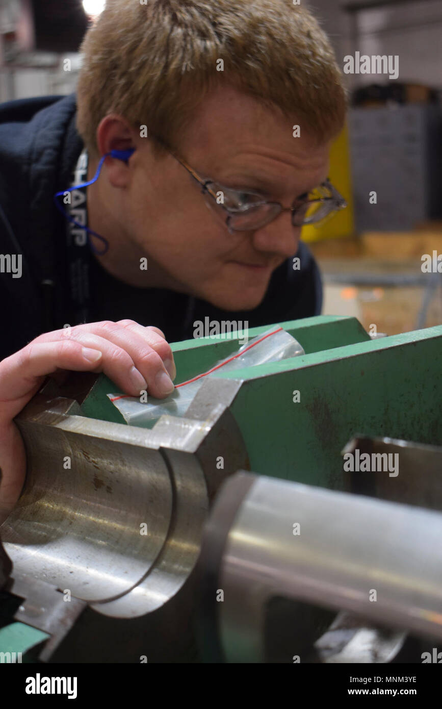 Crane Army Ammunition Activity employee Evan Prichard inspects ...
