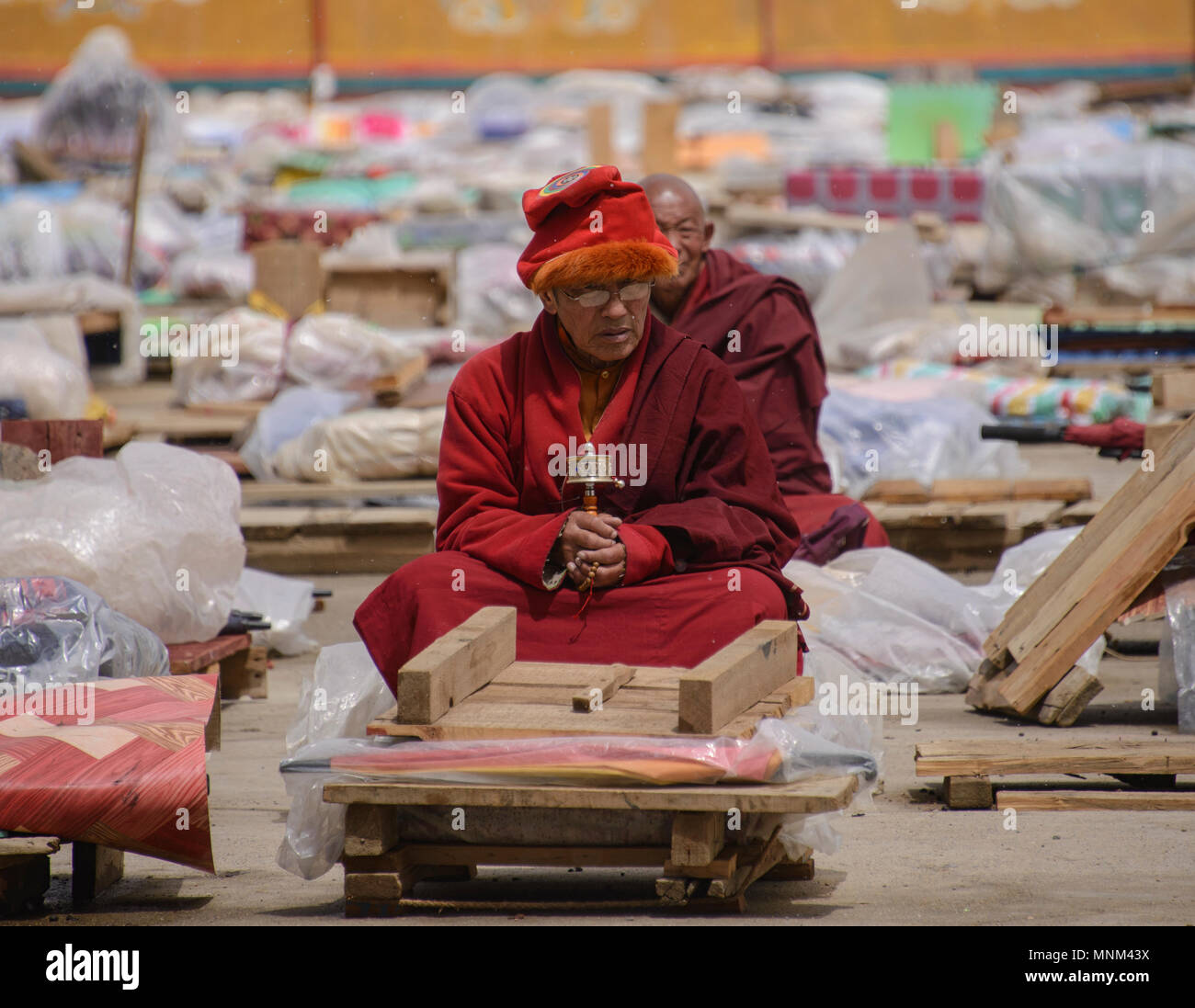 Tibetan monk on his meditation platform, Yarchen Gar, Sichuan, China ...