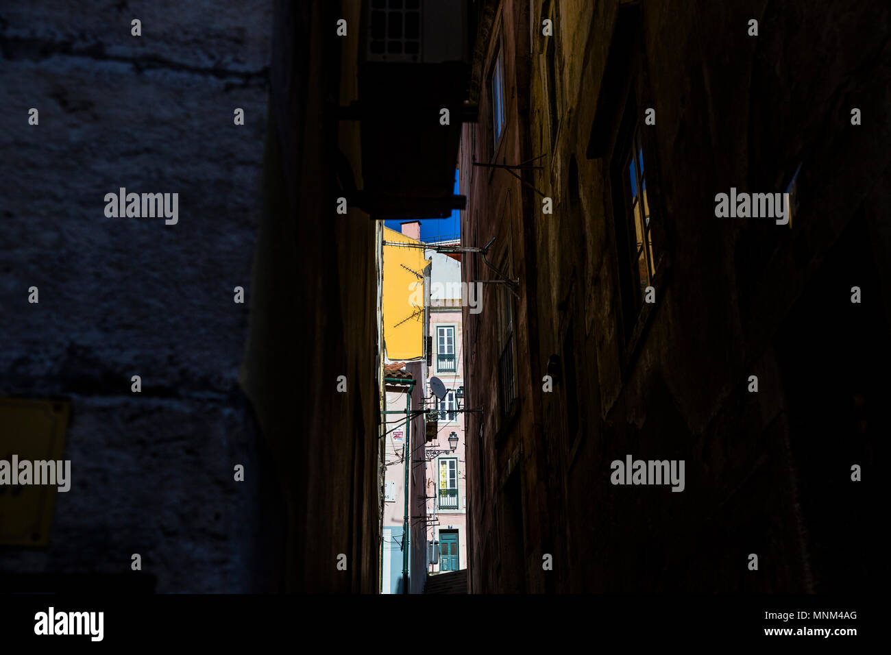 Narrow alley bright blue walls hi-res stock photography and images - Alamy