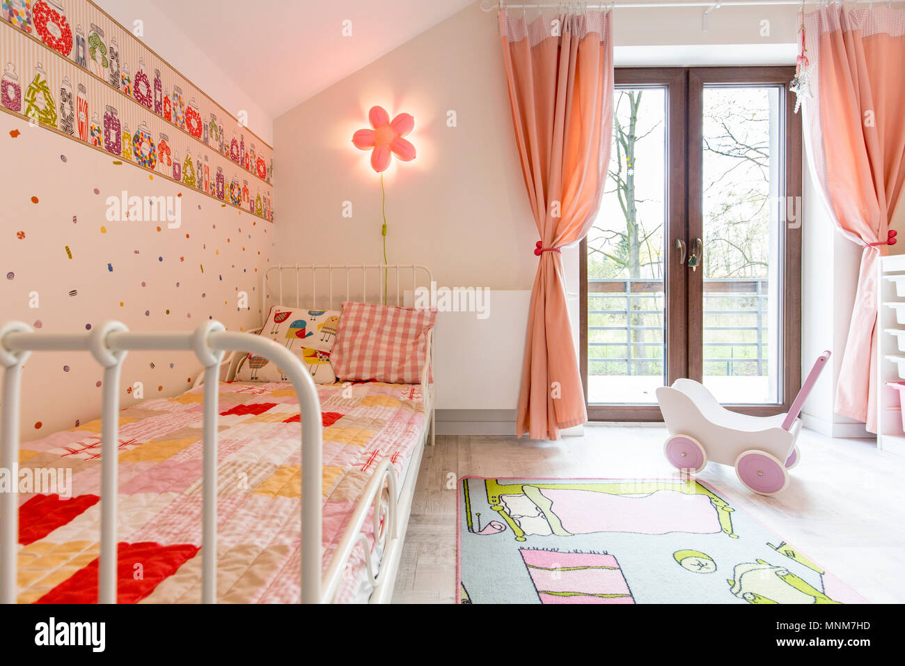 Shot of a spacious pink bedroom for a little girl Stock Photo - Alamy