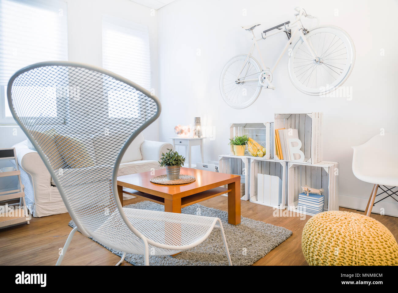 Cozy student's studio with modern stylish decor. Fancy armchair and ...