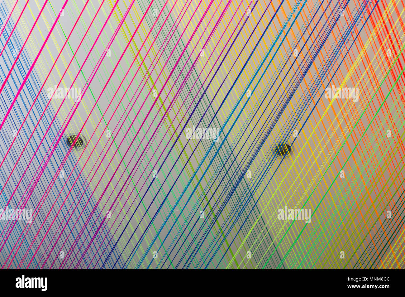 Lines of colourful wool strings as an artistic display Stock Photo - Alamy