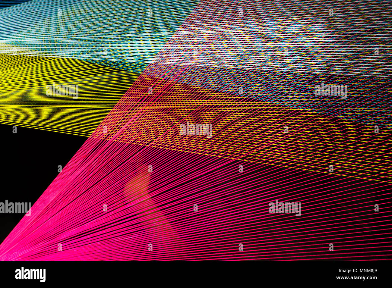 Lines of colourful wool strings as an artistic display Stock Photo - Alamy