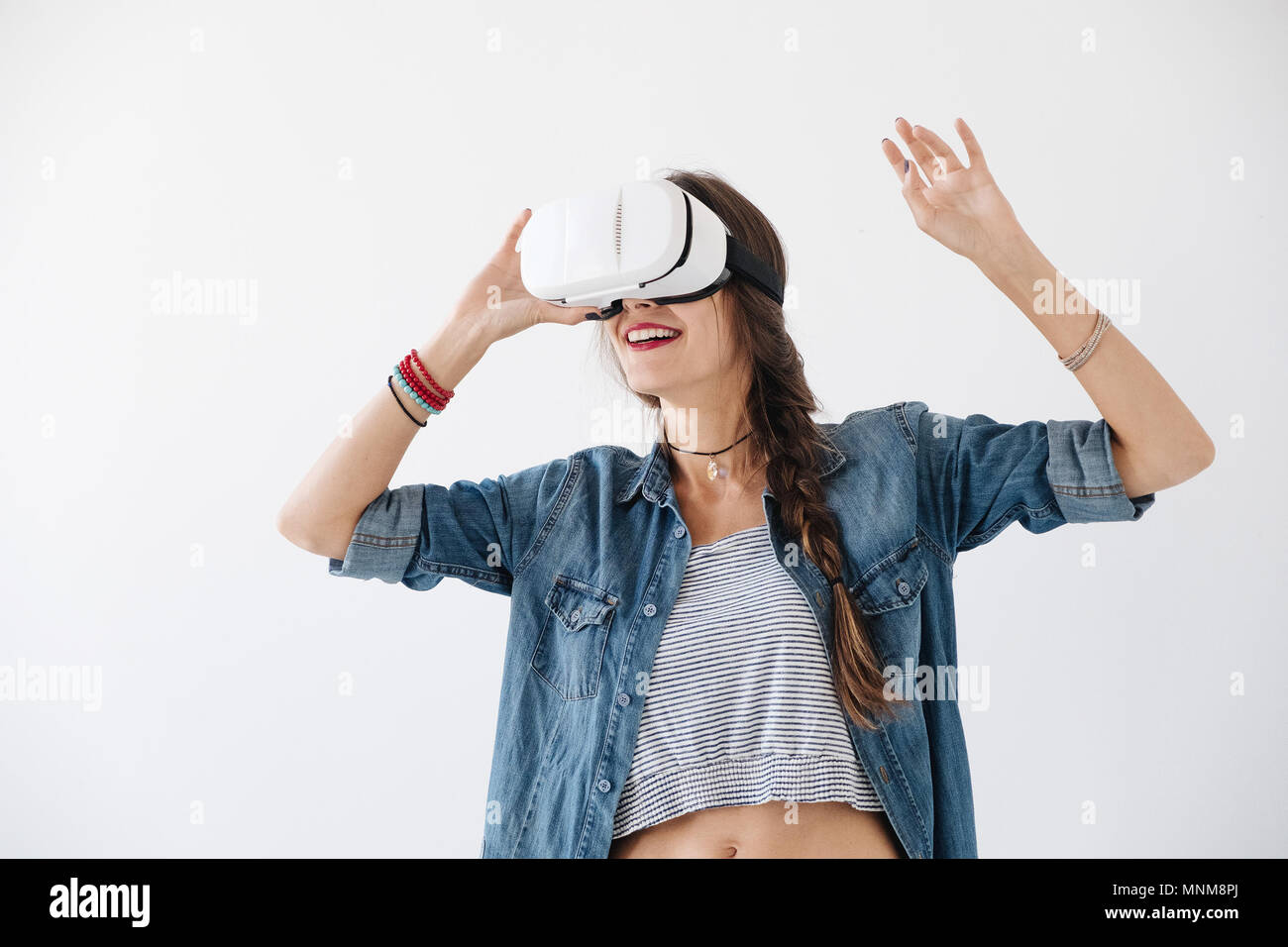 Attractive woman experiencing vr technology Stock Photo - Alamy