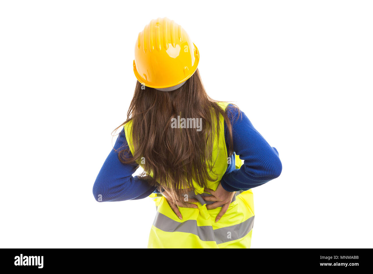 Rear view of young female architect or engineer feeling strong back ...