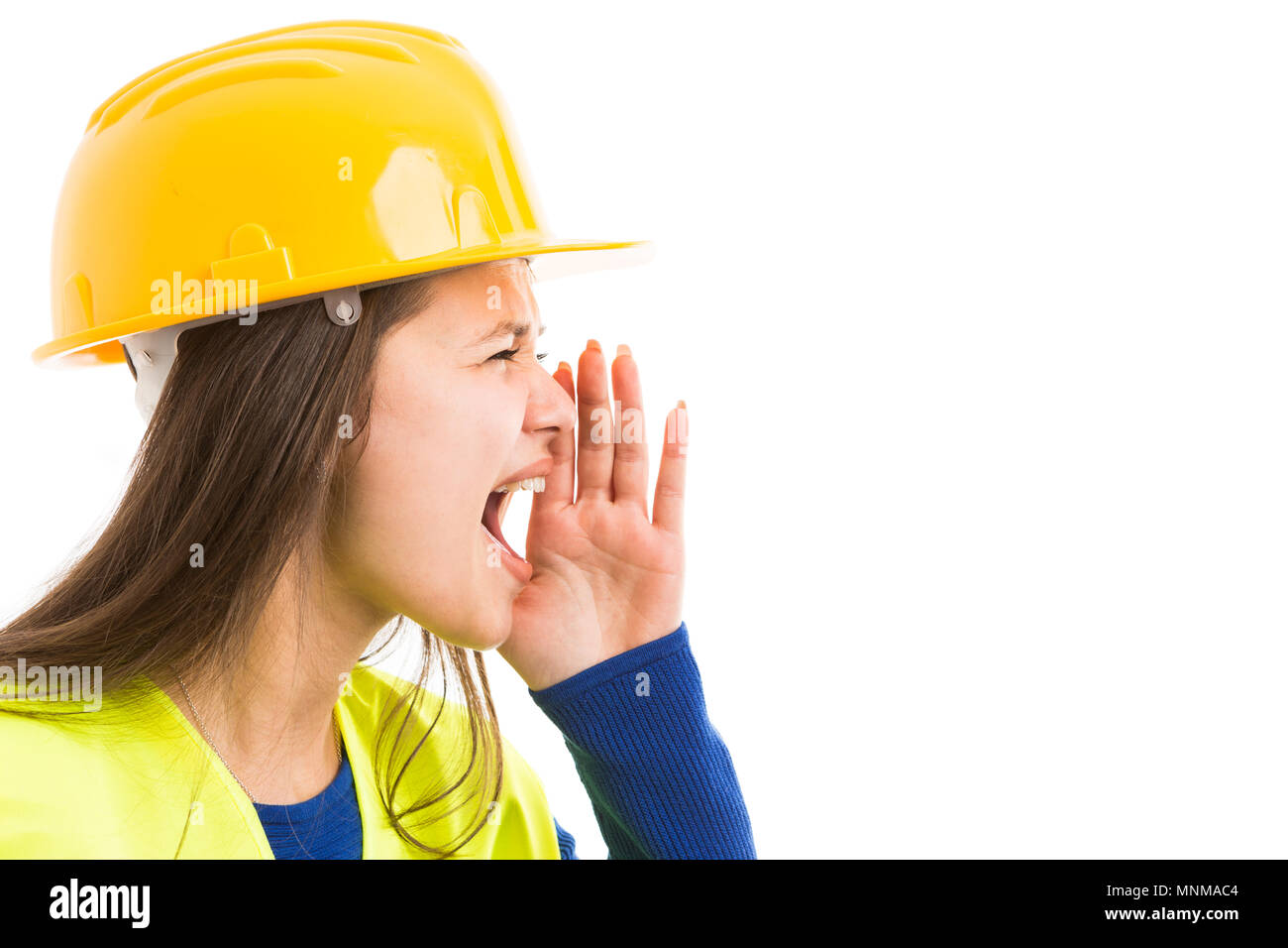 Young woman architect or engineer screaming with hand on mouth as angry ...