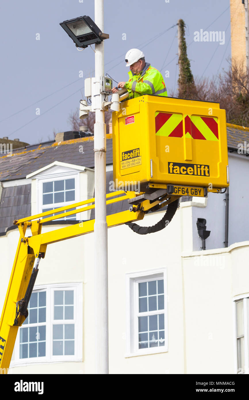 telecoms engineer working at height on a cherry picker, hastings, uk ...