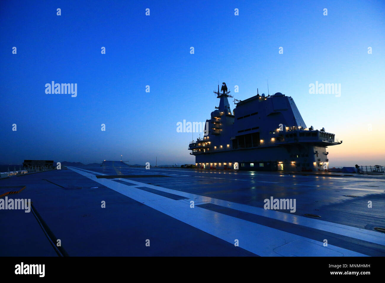 Dalian. 18th May, 2018. China's second aircraft carrier returns to dock ...
