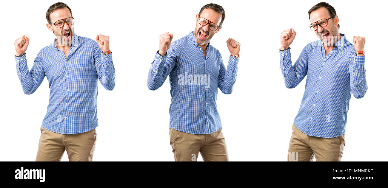 Middle age handsome man happy and excited expressing winning gesture ...