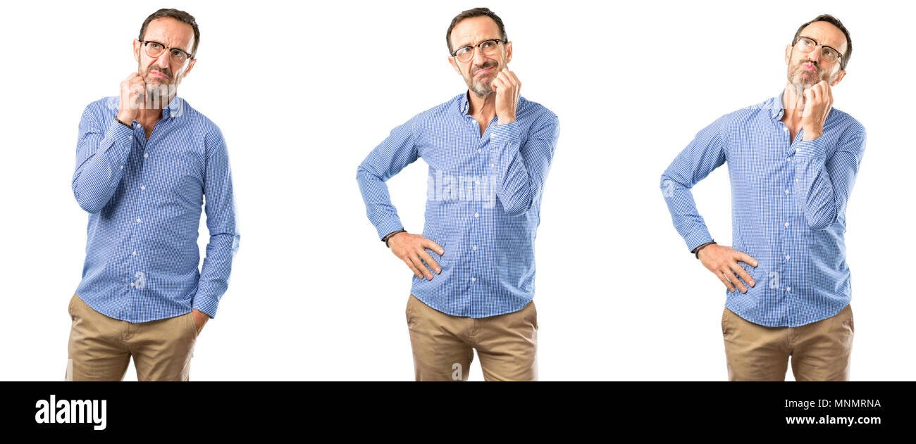 Middle age handsome man thinking and looking up expressing doubt and ...