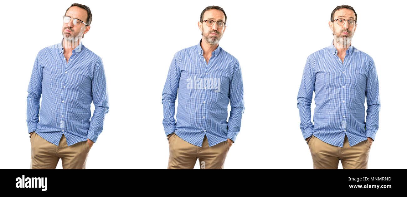 Middle age handsome man puffing out cheeks, having fun making funny ...