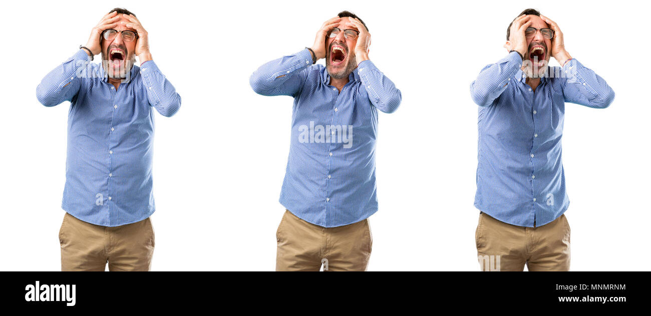 Middle age handsome man stressful keeping hands on head, terrified in ...