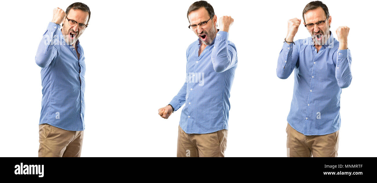 Middle age handsome man happy and excited expressing winning gesture ...