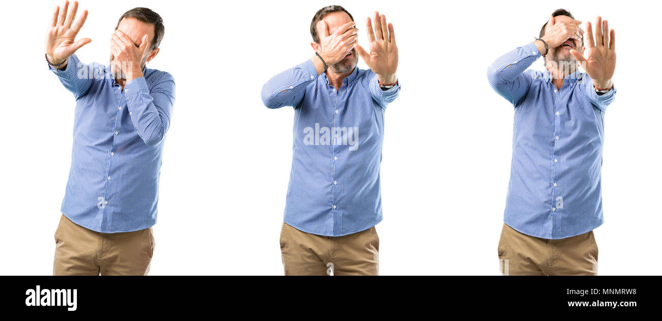 Middle age handsome man stressful and shy keeping hand on head, tired ...