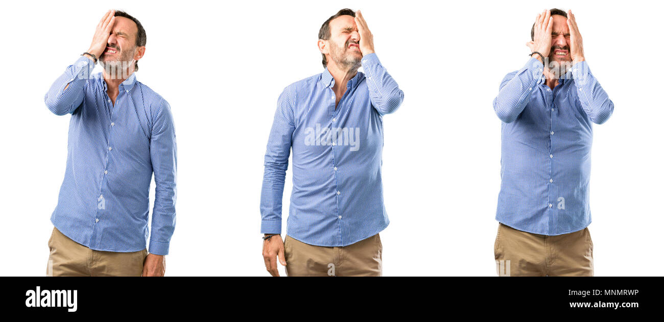 Middle age handsome man stressful keeping hand on head, tired and ...