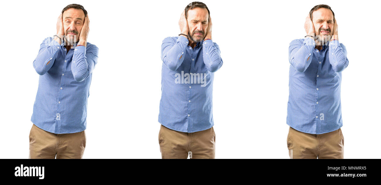 Middle age handsome man covering ears ignoring annoying loud noise ...