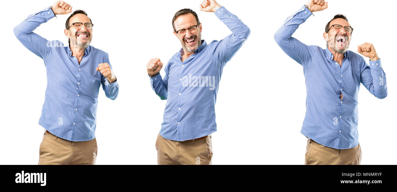 Middle age handsome man happy and excited expressing winning gesture ...