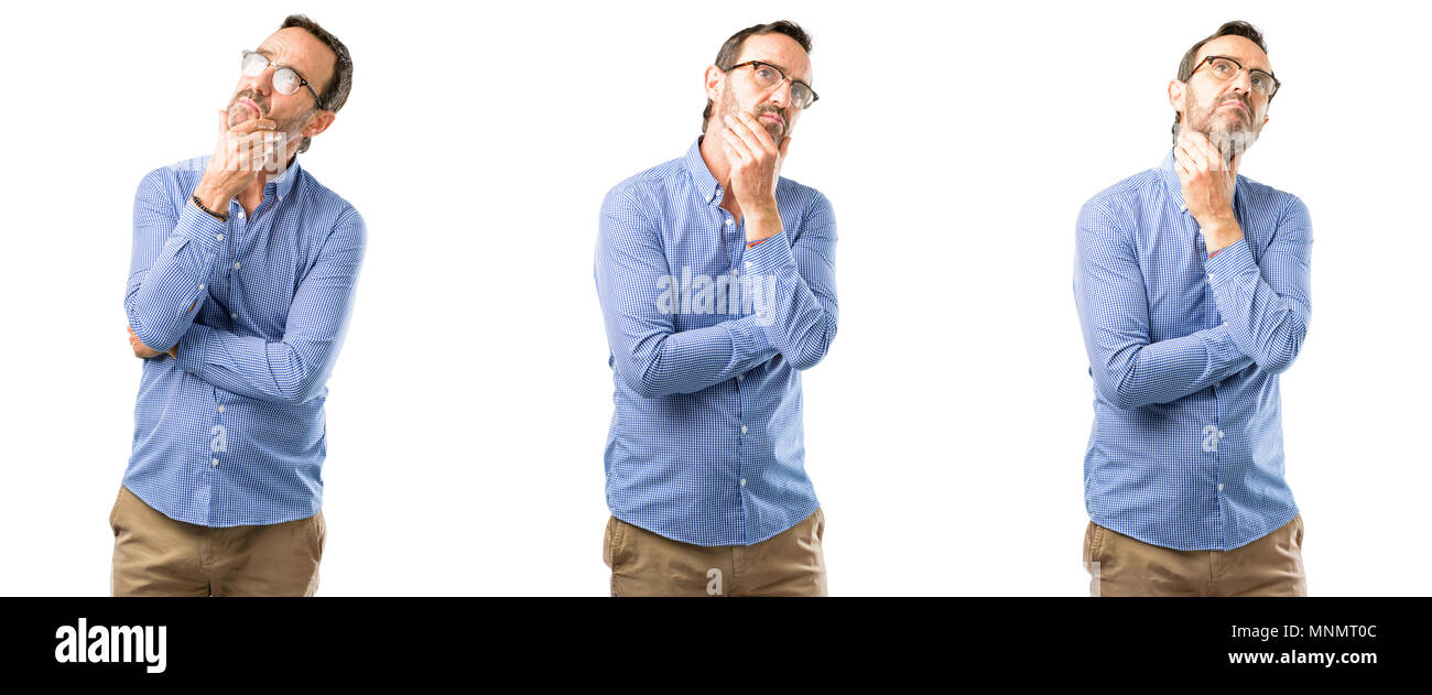 Middle age handsome man thinking and looking up expressing doubt and ...