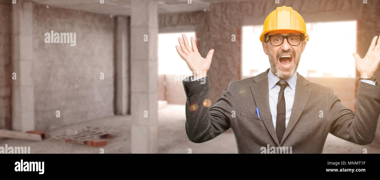 Senior architect or engineer happy and surprised cheering expressing ...