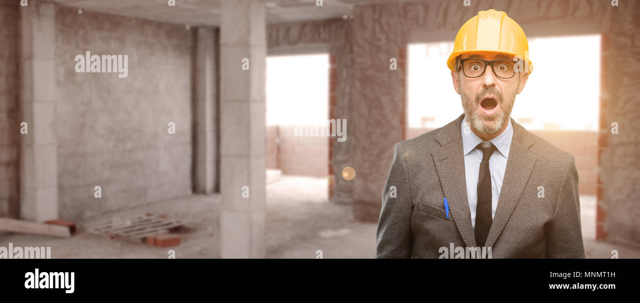 Senior architect or engineer scared in shock, expressing panic and fear ...
