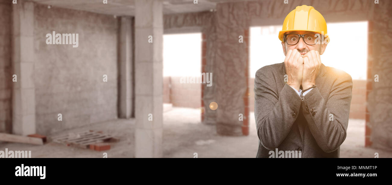 Senior architect or engineer terrified and nervous expressing anxiety ...