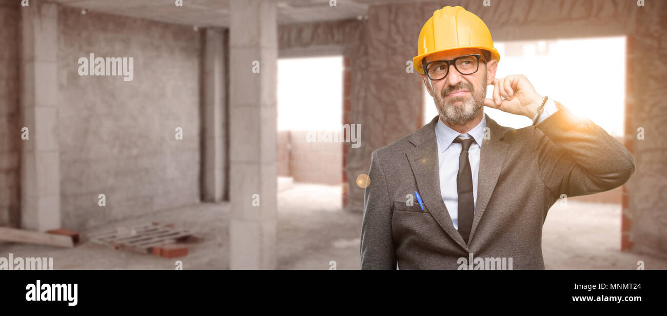 Senior architect or engineer doubt expression, confuse and wonder ...