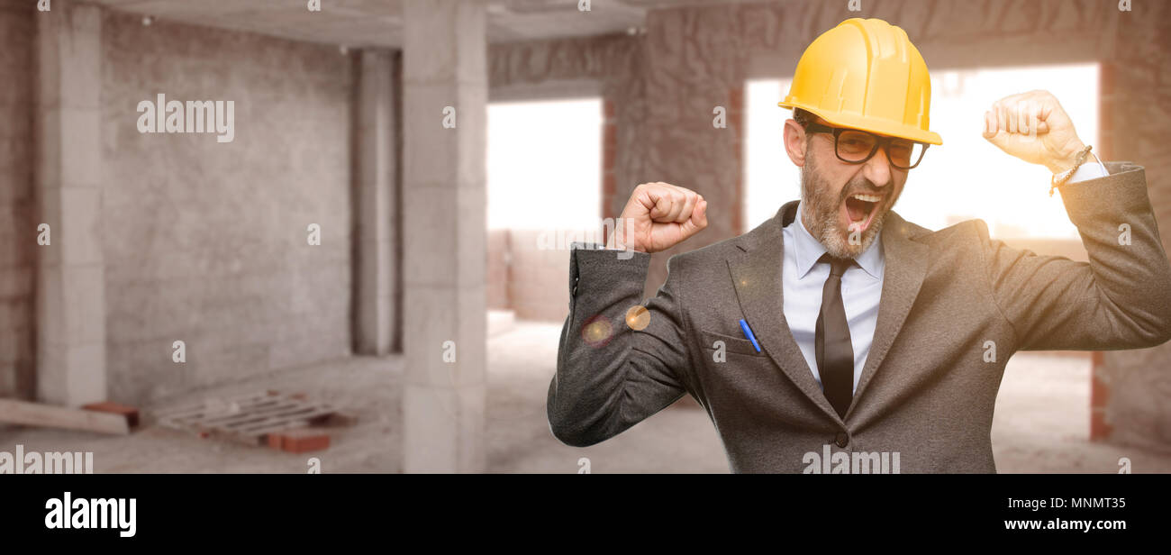 Senior architect or engineer happy and excited celebrating victory ...