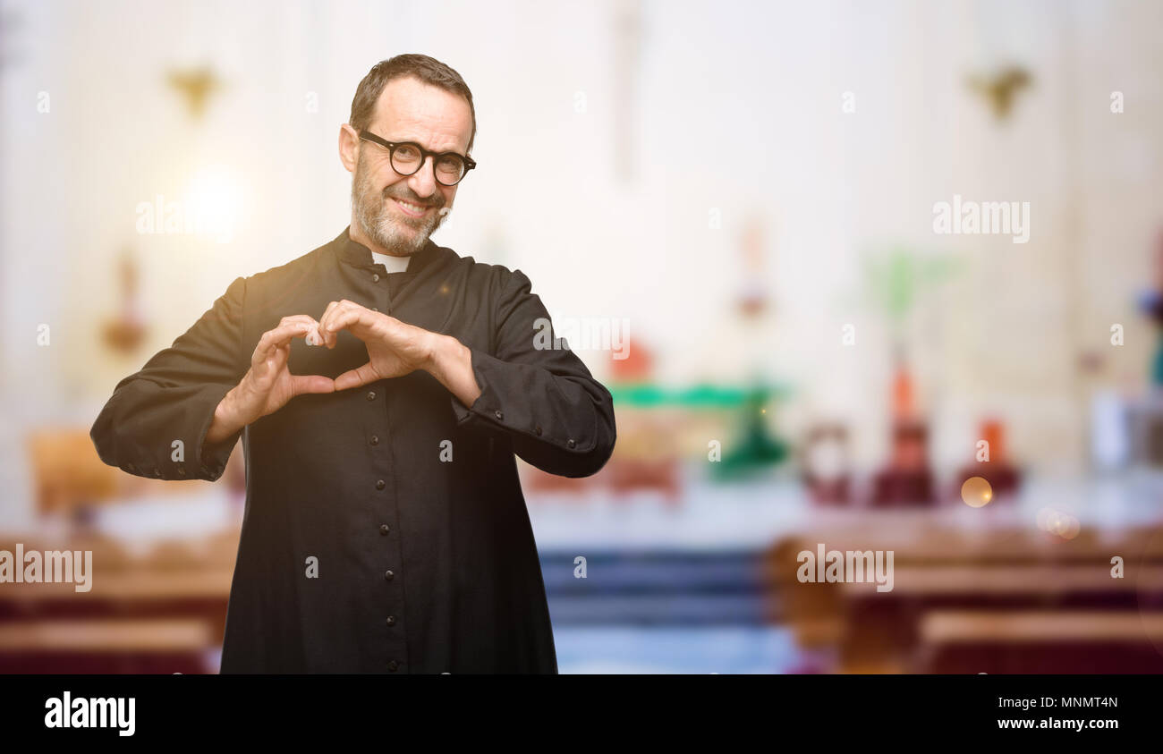 Priest religion man happy showing love with hands in heart shape ...