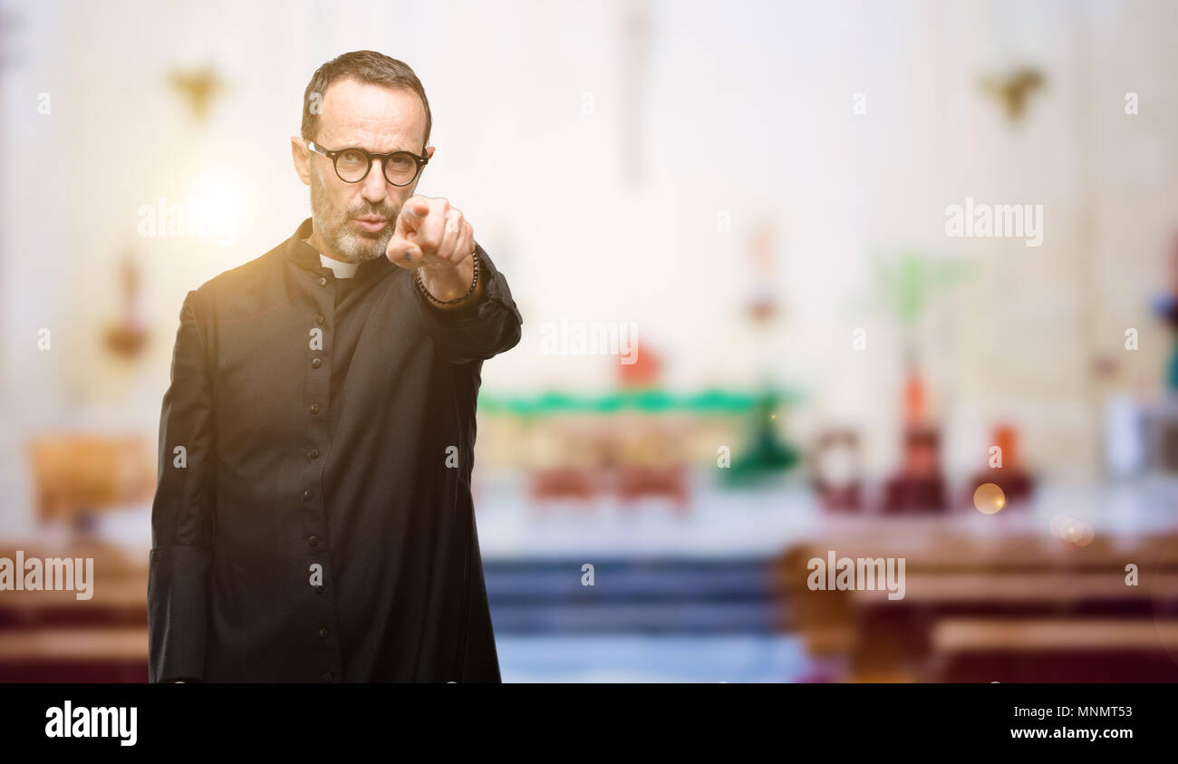 Priest religion man pointing to the front with finger at church Stock ...