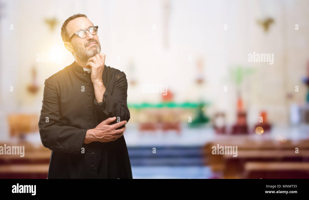 Priest religion man thinking and looking up expressing doubt and wonder ...