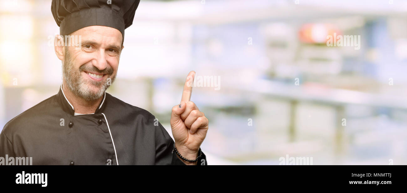 Man pointing kitchen apron hi-res stock photography and images - Alamy