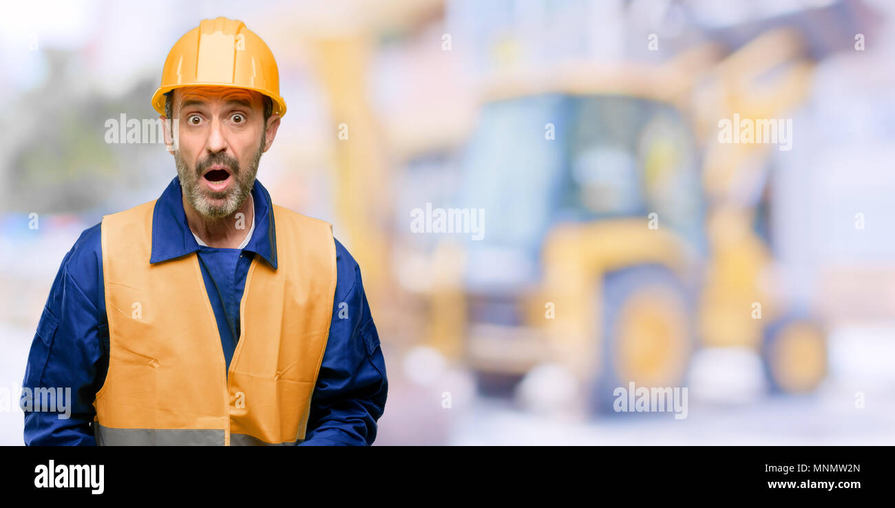 Senior engineer man, construction worker scared in shock, expressing ...