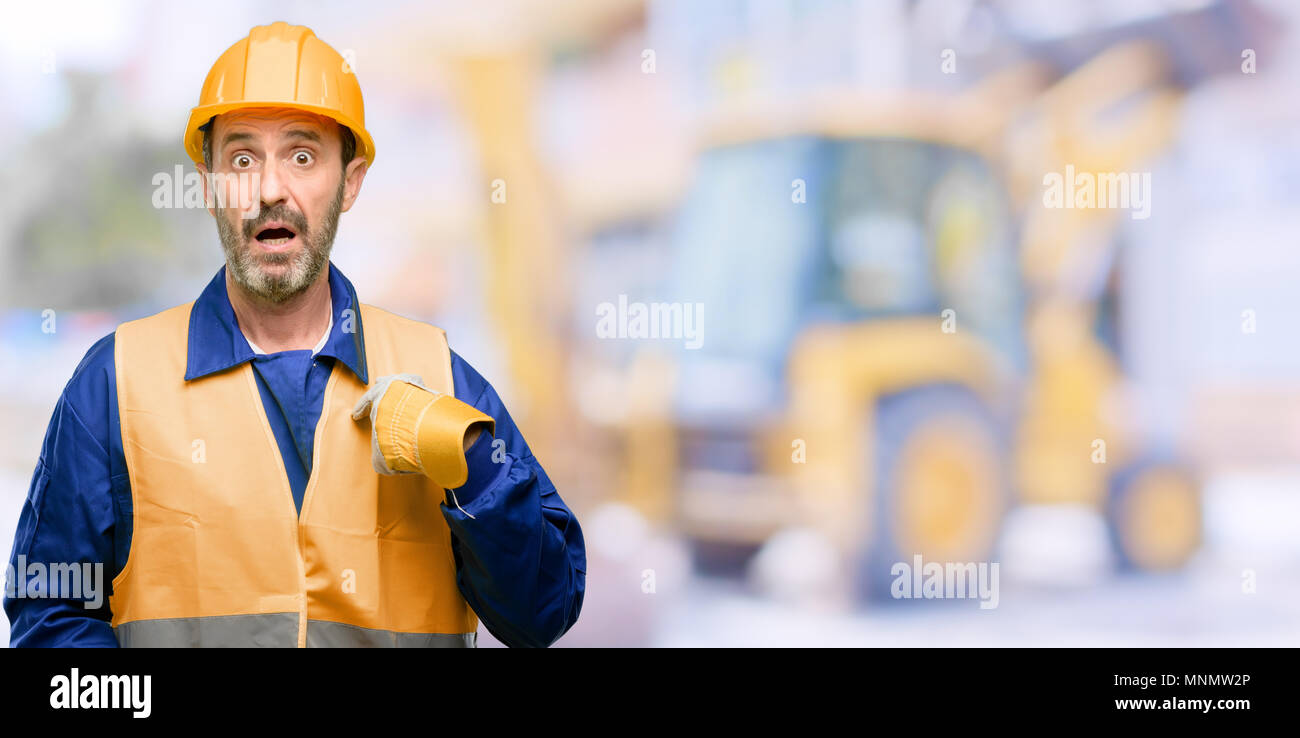 Senior engineer man, construction worker happy and surprised cheering ...