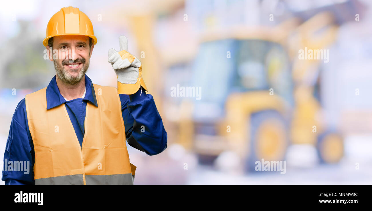Senior engineer man, construction worker raising finger, the number one ...