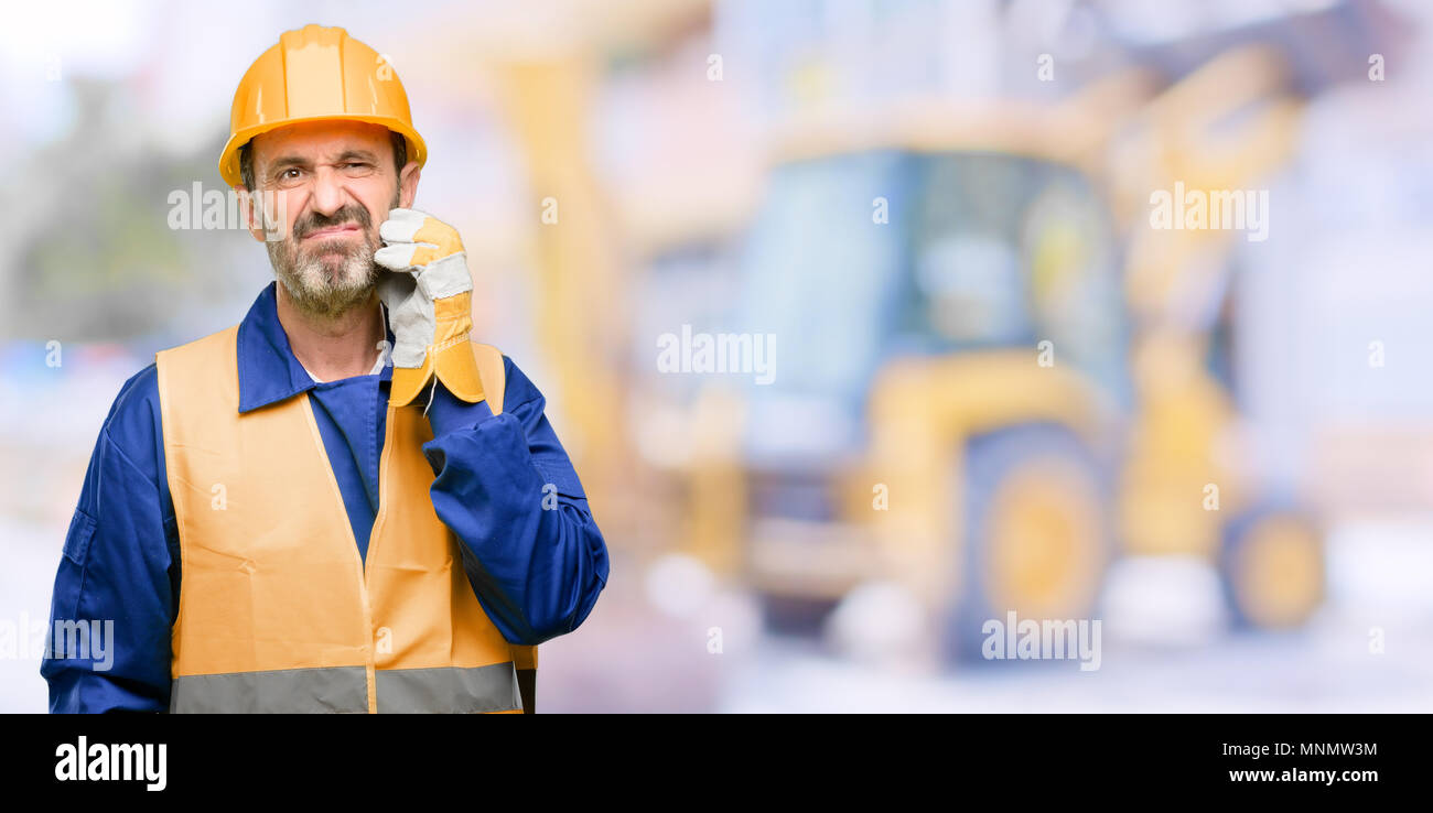 Senior engineer man, construction worker doubt expression, confuse and ...