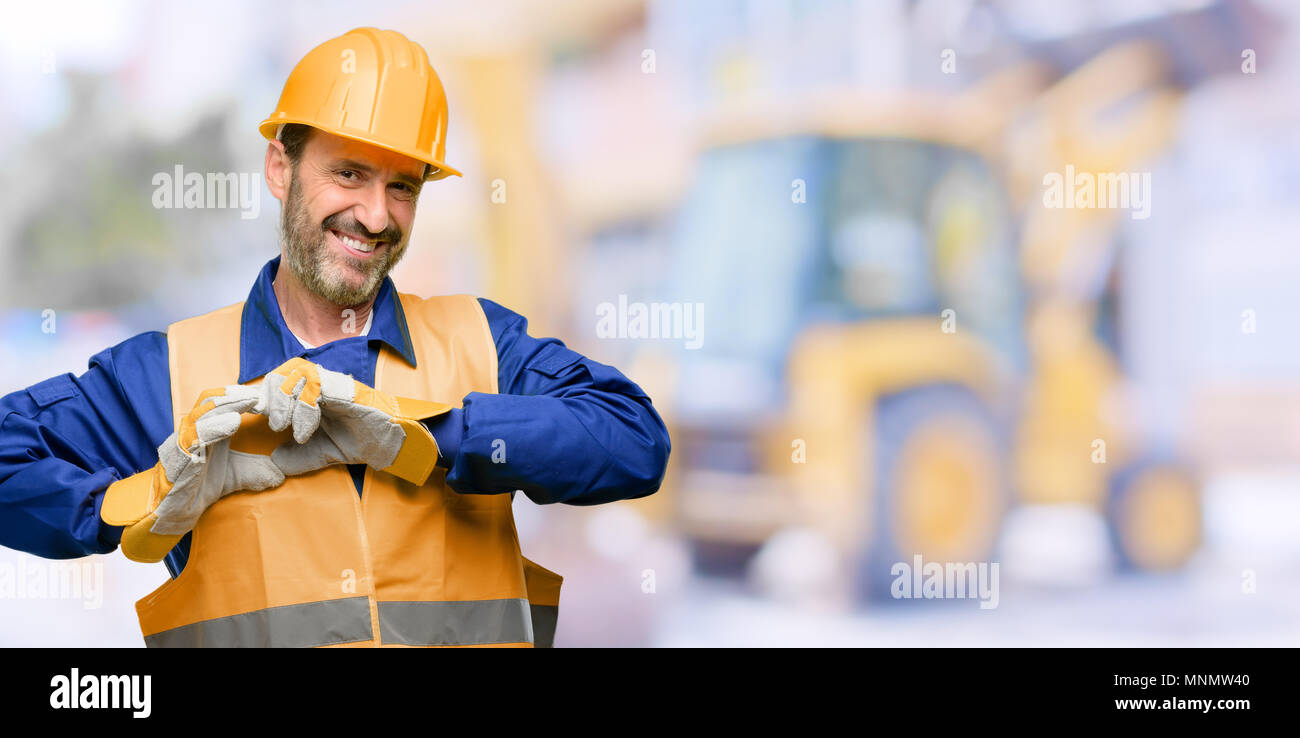 Senior engineer man, construction worker happy showing love with hands ...