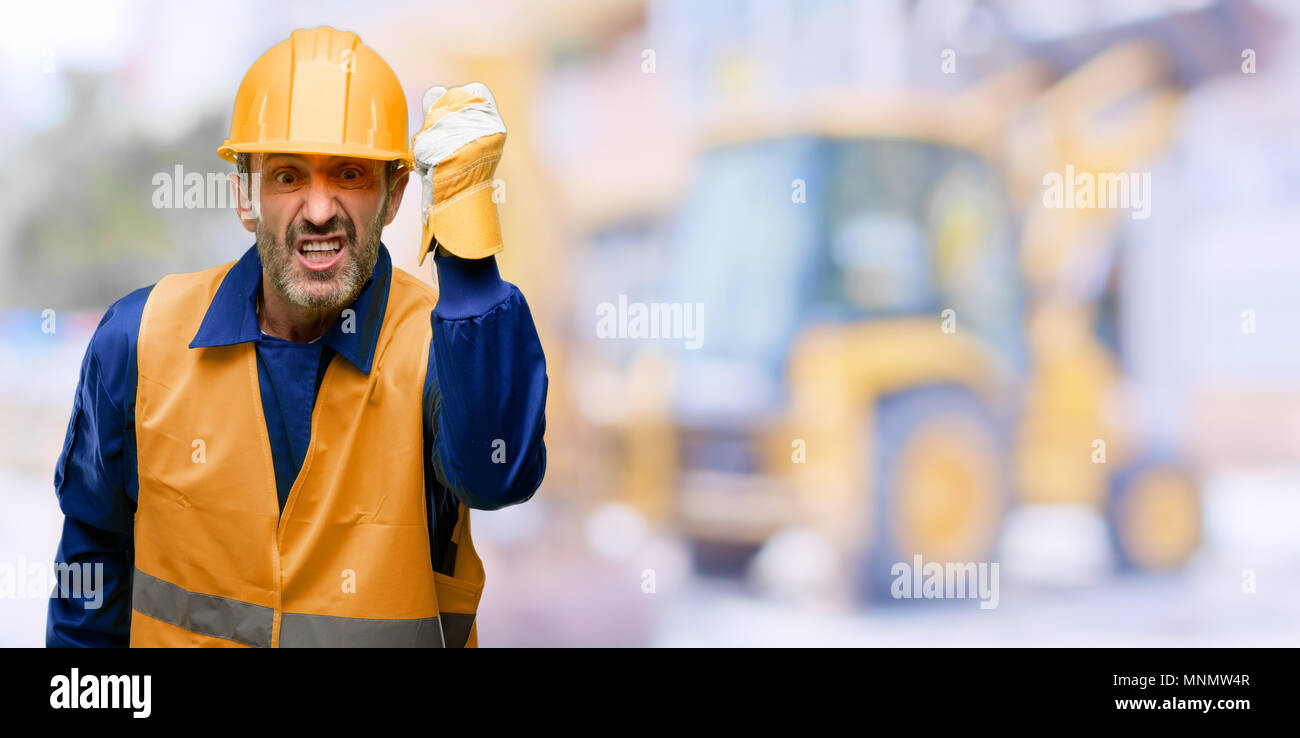 Senior engineer man, construction worker irritated and angry expressing ...