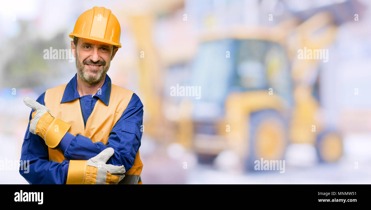 Senior engineer man, construction worker pointing away side with finger ...