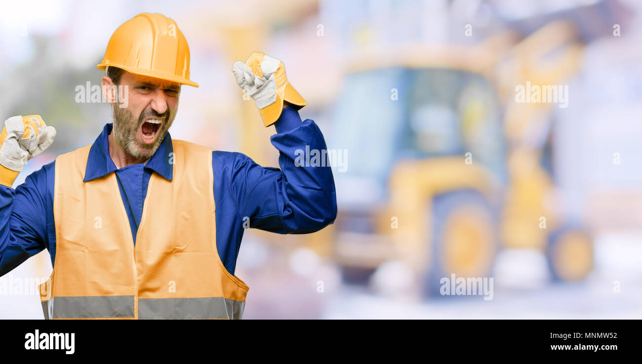 Senior engineer man, construction worker happy and excited celebrating ...