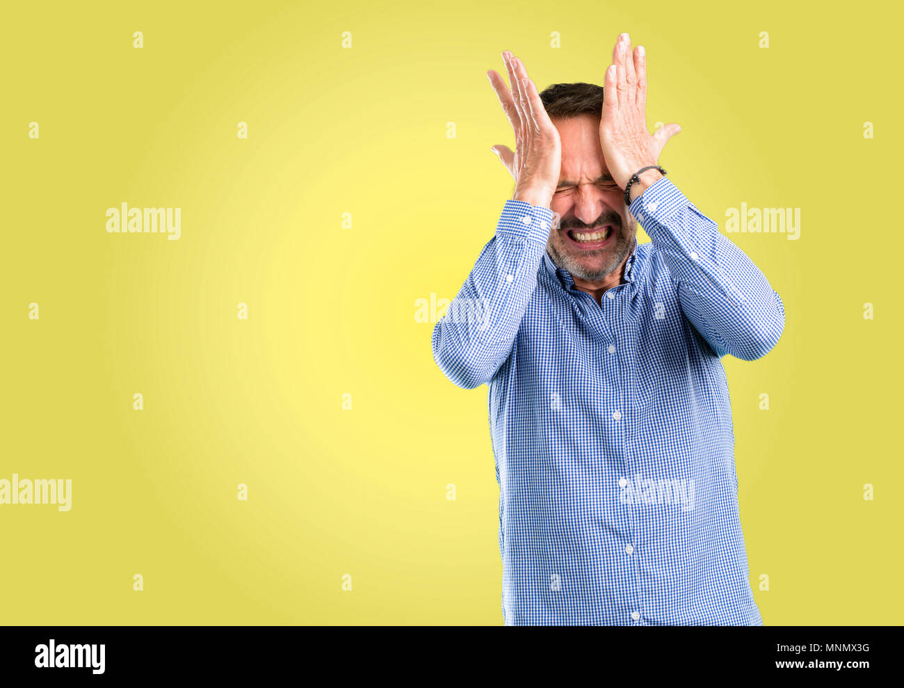 Handsome middle age man terrified and nervous expressing anxiety and ...