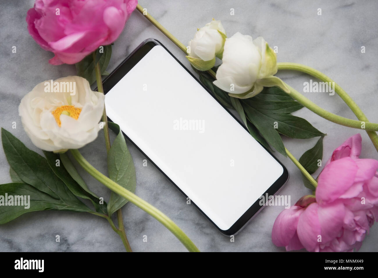 Smart phone and flowers Stock Photo - Alamy
